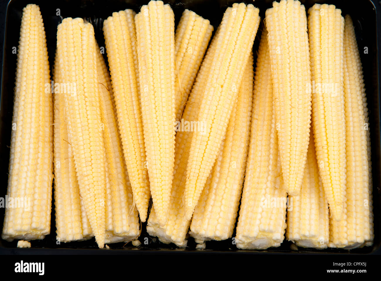 punnet of baby sweetcorn Stock Photo - Alamy