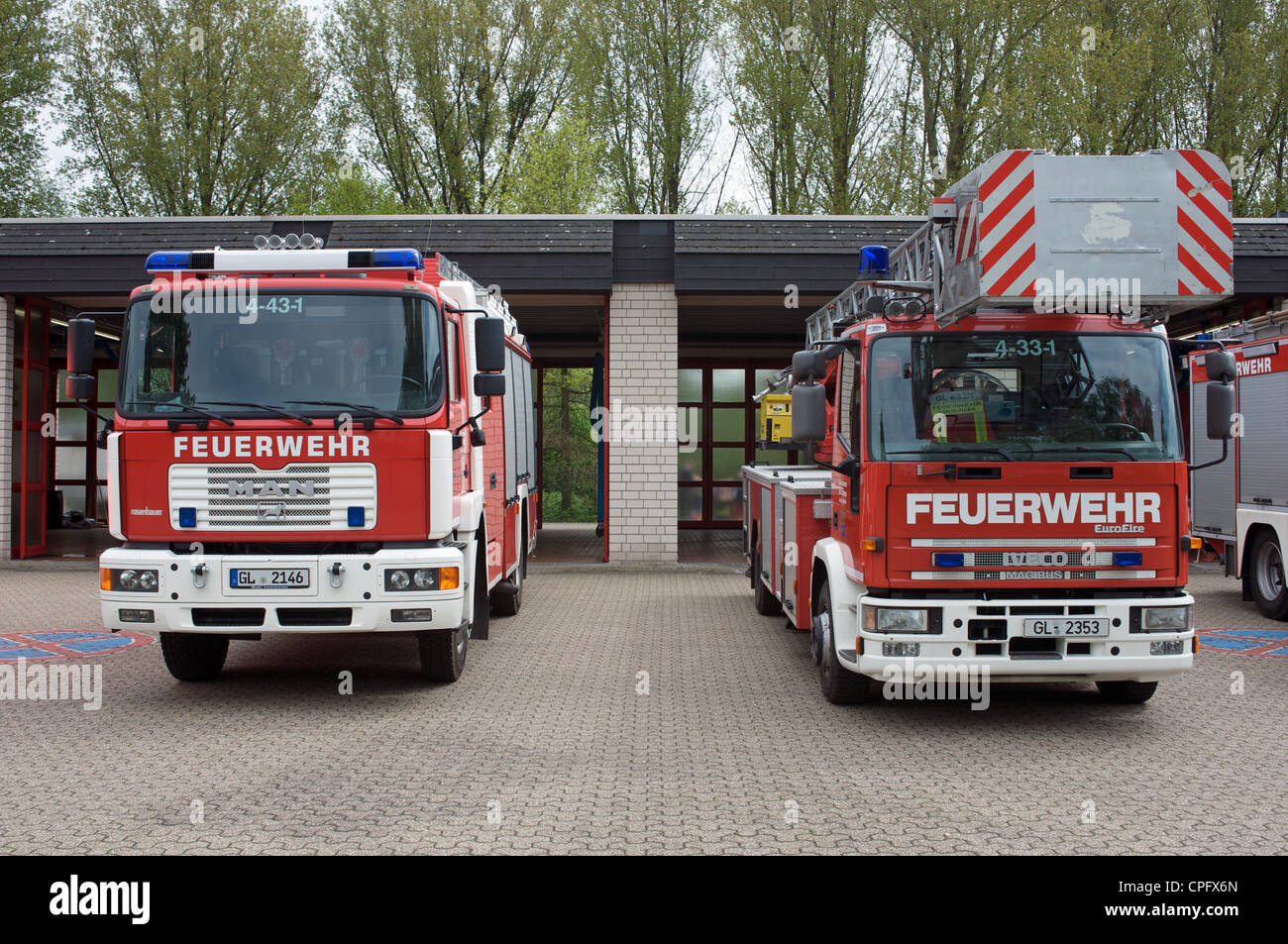 Turntable ladder and fire engine outside fire station Germany Stock ...