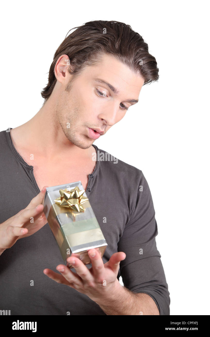 Man holding gift Stock Photo - Alamy