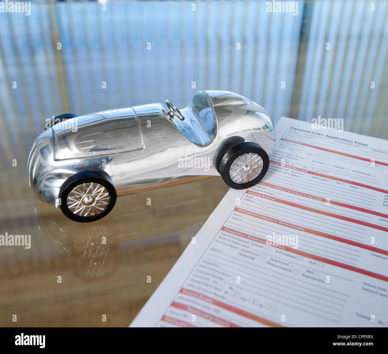 Toy car and application form Stock Photo - Alamy