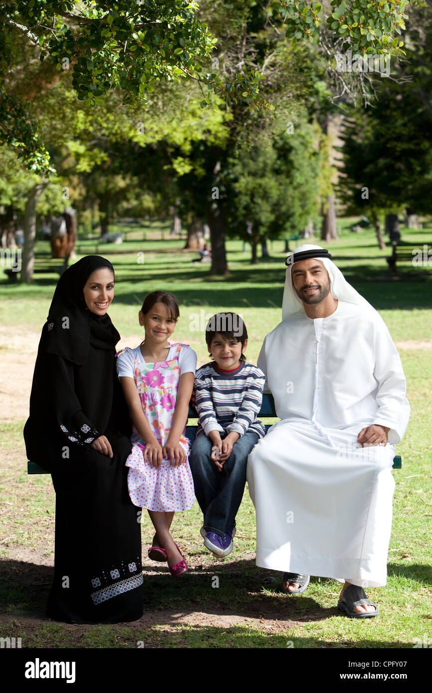 Portrait of an arab family sitting together at the park, smiling Stock Photo - Alamy