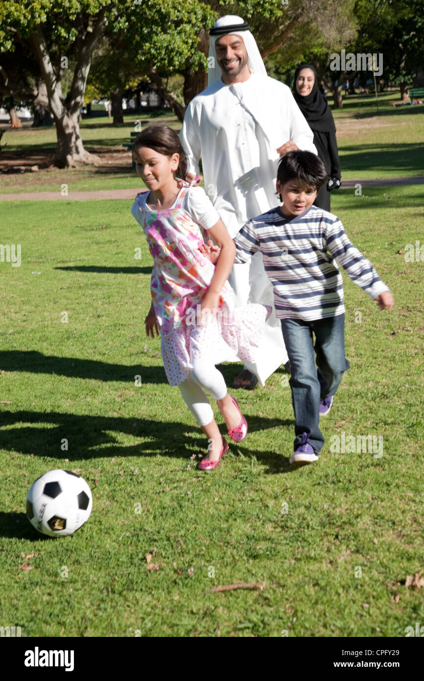 Arab family playing soccer together at the park Stock Photo - Alamy