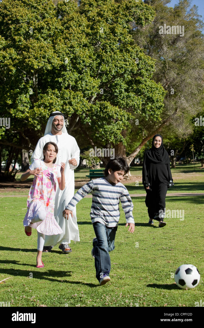 Arab family playing soccer together at the park Stock Photo - Alamy