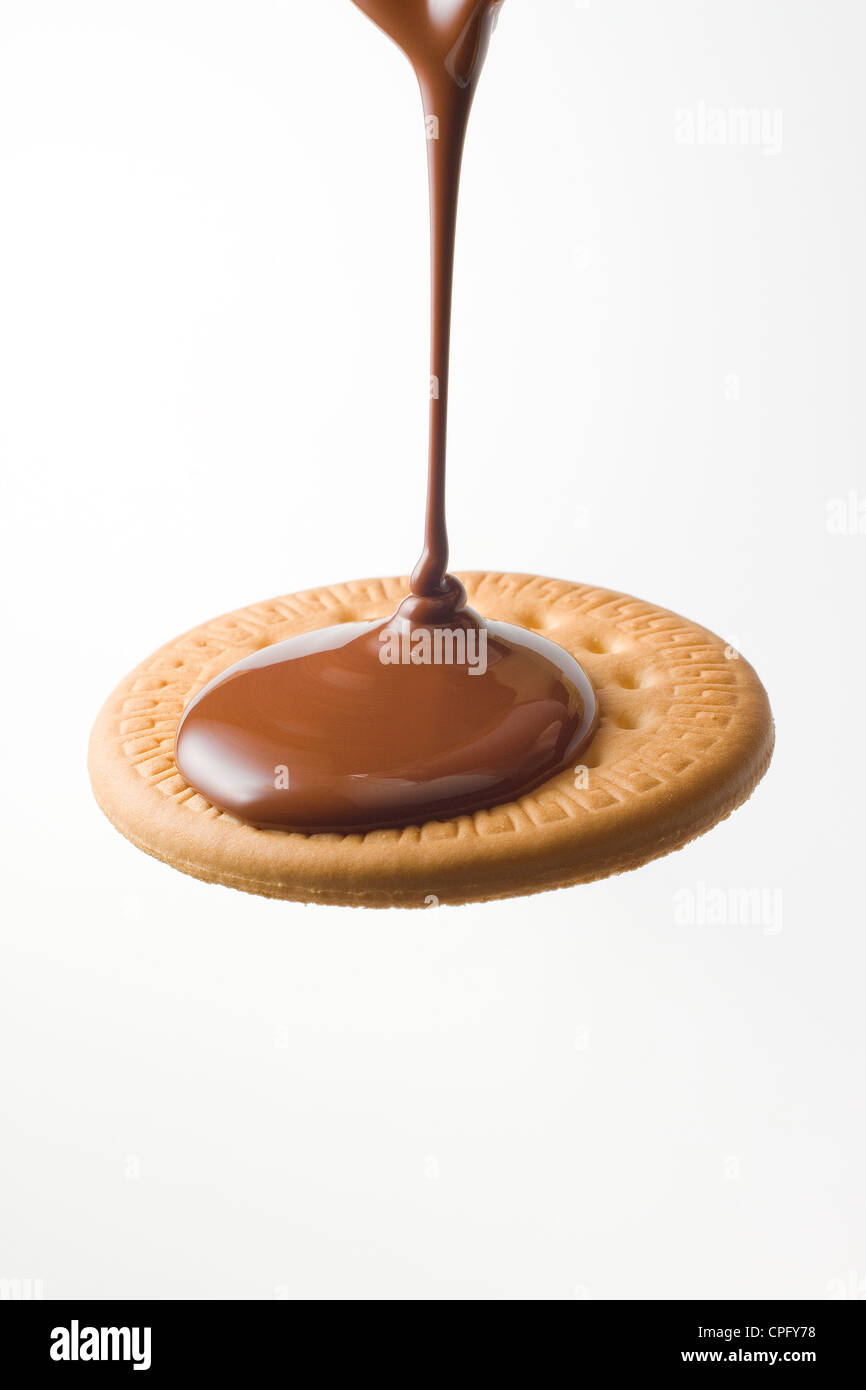 Melt Chocolate On Biscuit Stock Photo - Alamy
