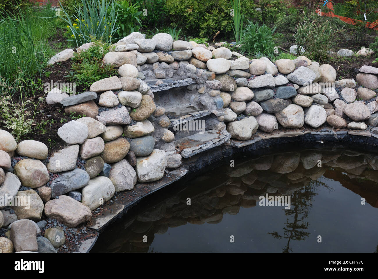 unfinished garden pond with masonary structure horizontal Stock Photo ...