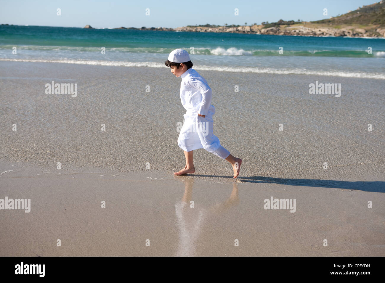 Arab boy running at the beach Stock Photo - Alamy