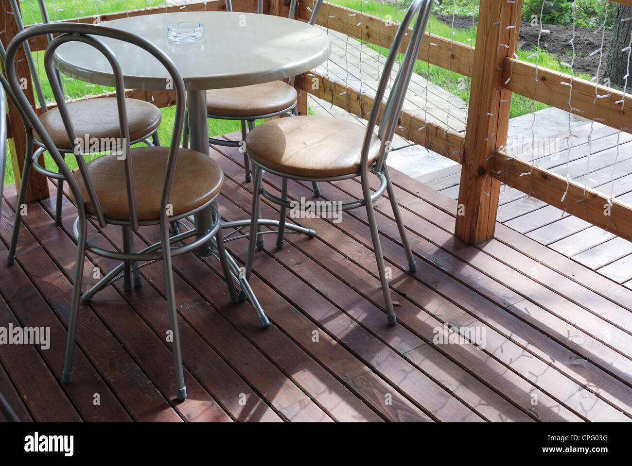 table and chairs on the terrace in summer Stock Photo - Alamy