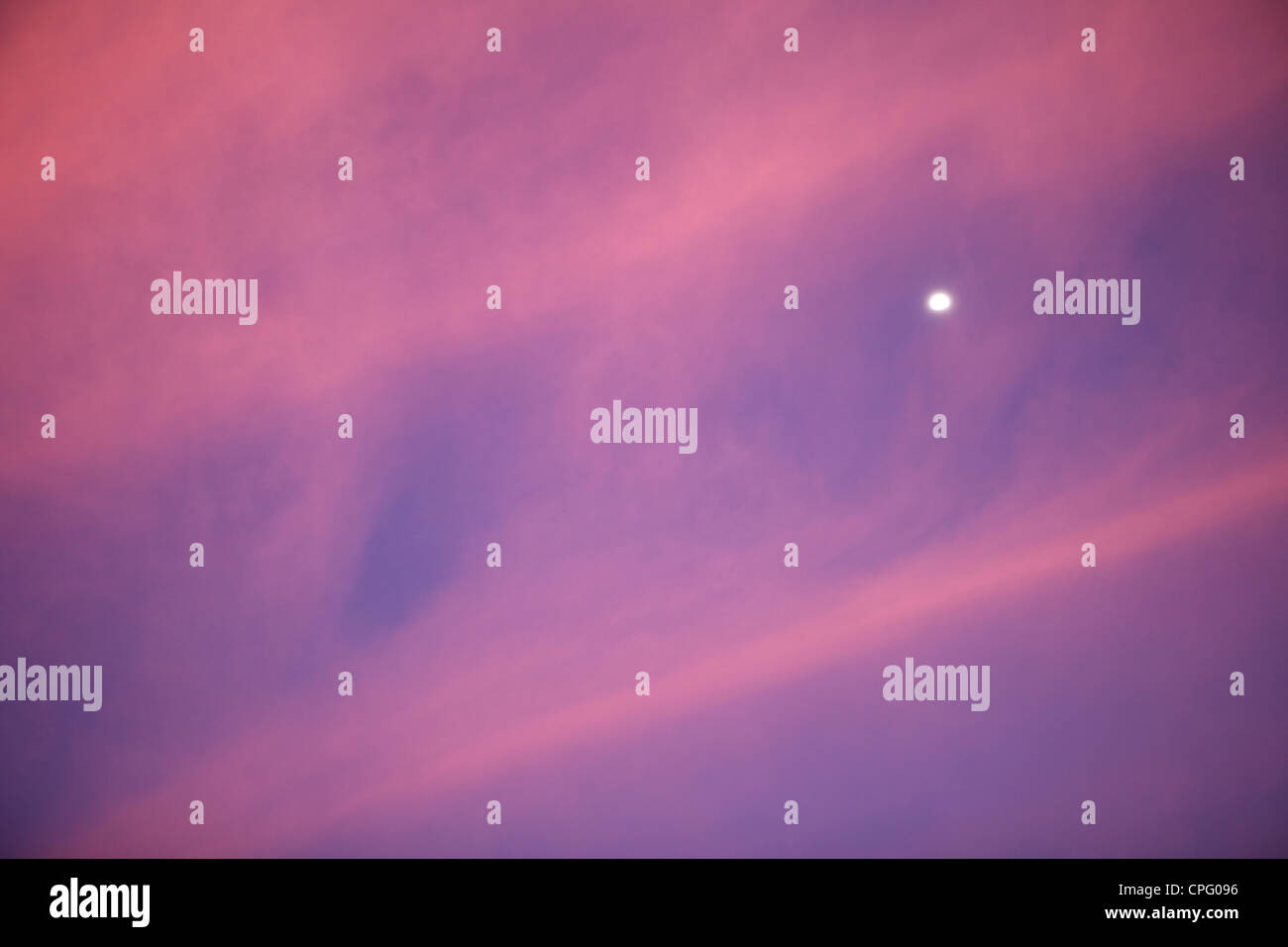 Pink sky with clouds and moon Stock Photo - Alamy