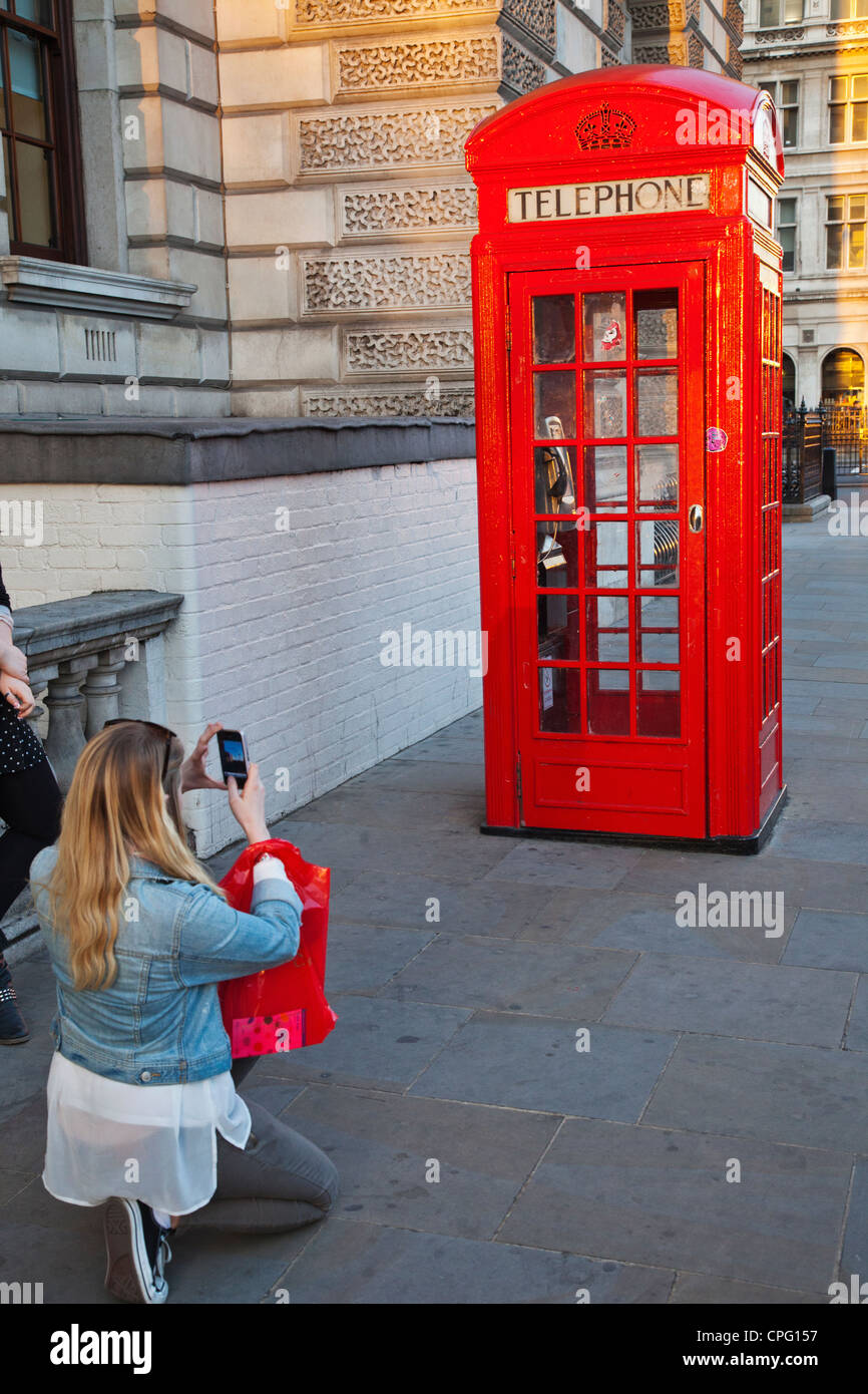 England, London, Westminster, Female Tourist Taking Photo of Red Phone ...