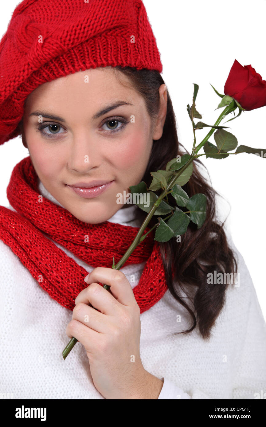 girl with red rose and assorted clothing Stock Photo - Alamy