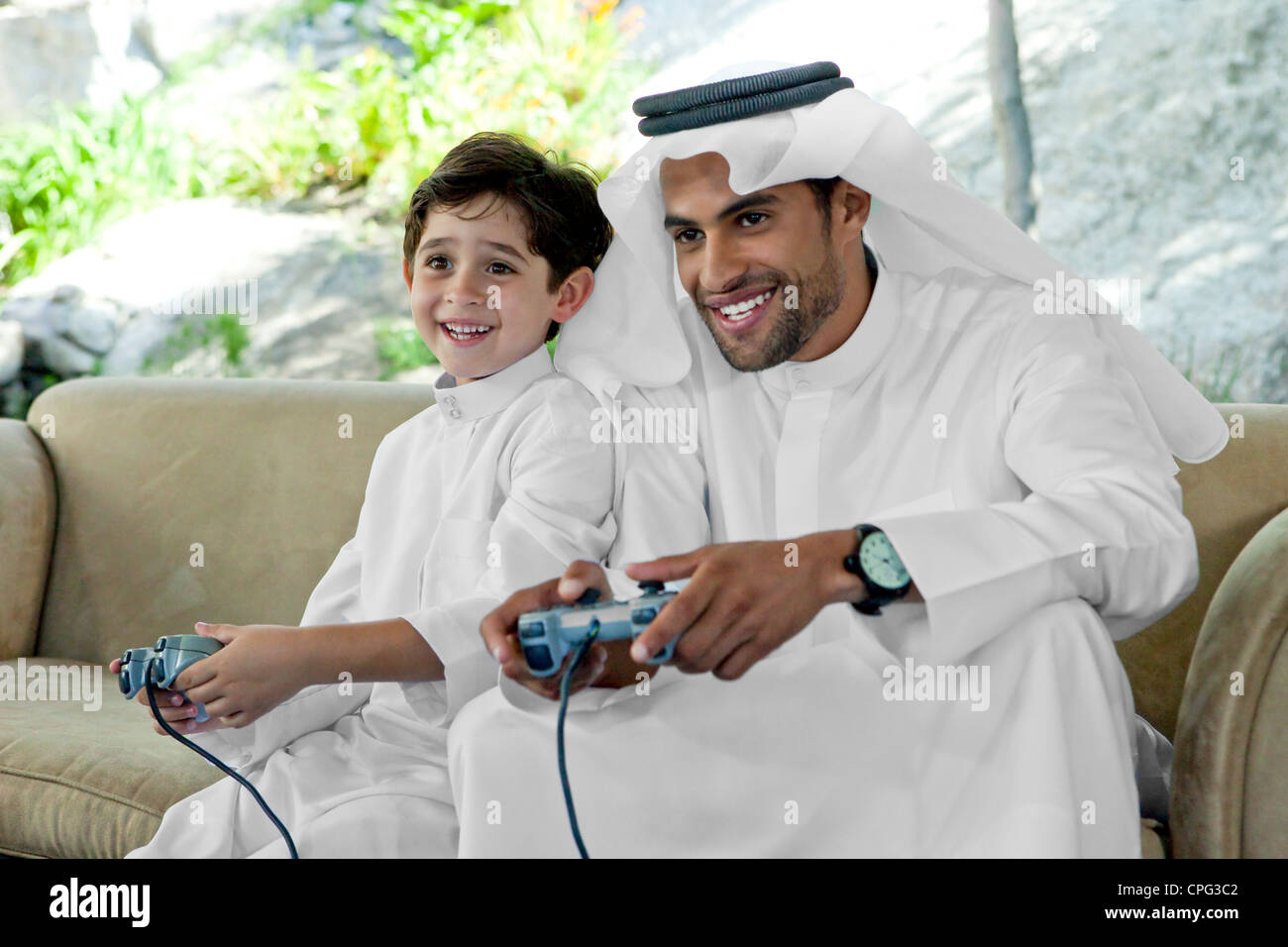 Arab Father And Son Playing Together High Resolution Stock Photography ...
