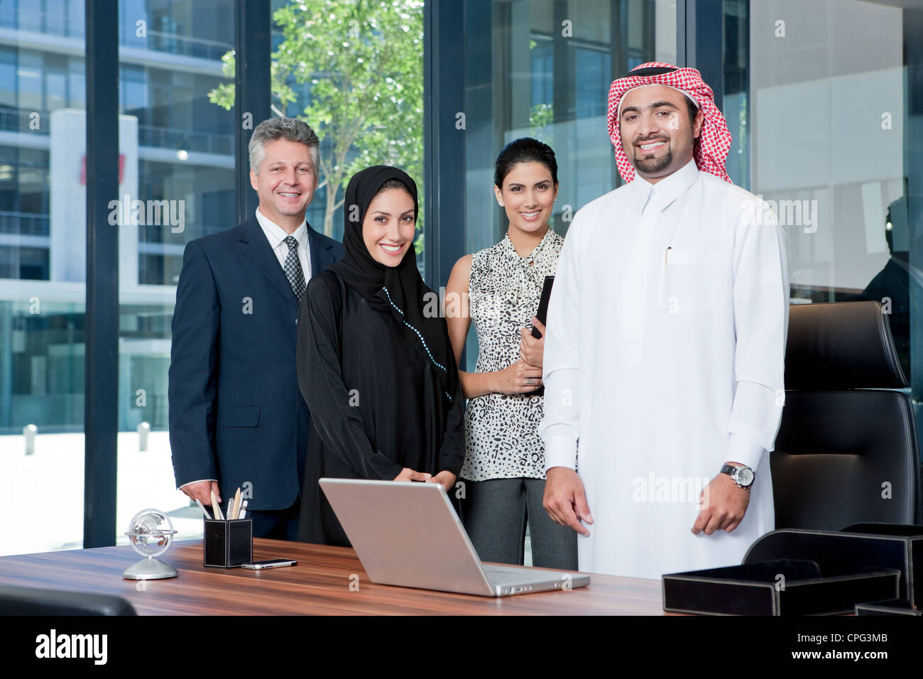 Portrait of business people standing in office, smiling Stock Photo - Alamy