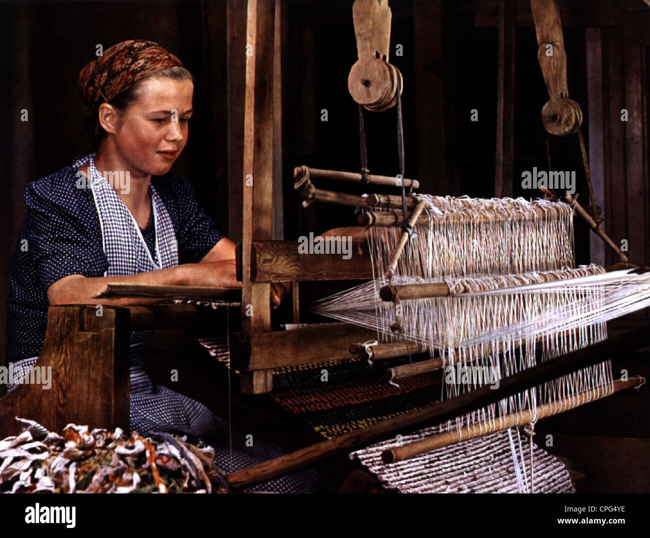 craft / handcraft, weaver, girl weaving carpet, loom, Finland, Lapland ...