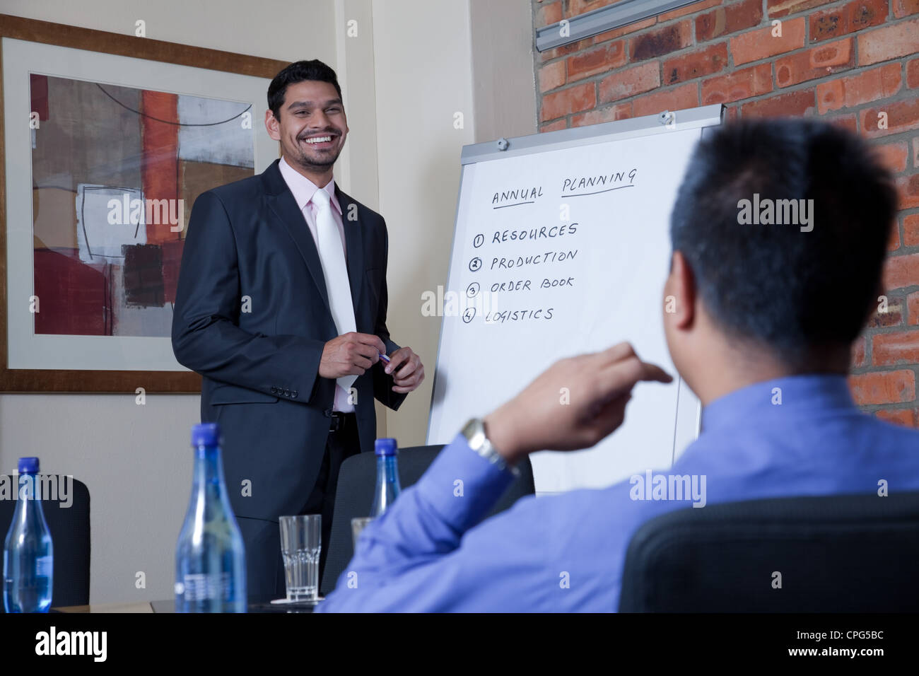Businessman giving presentation Stock Photo - Alamy