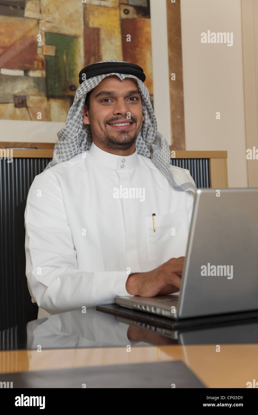 Arab businessman laptop smiling camera hi-res stock photography and ...