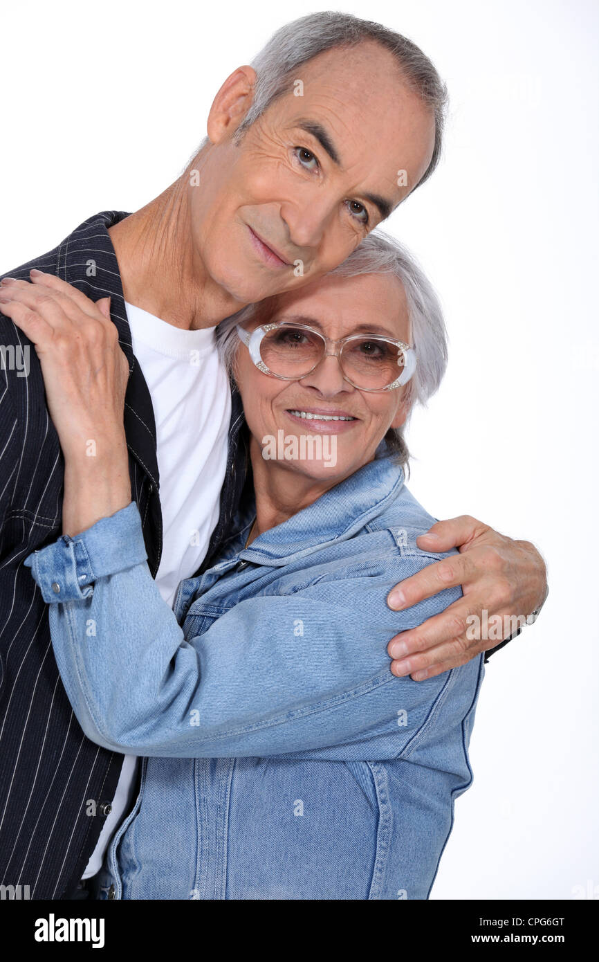 Elderly couple hugging Stock Photo - Alamy