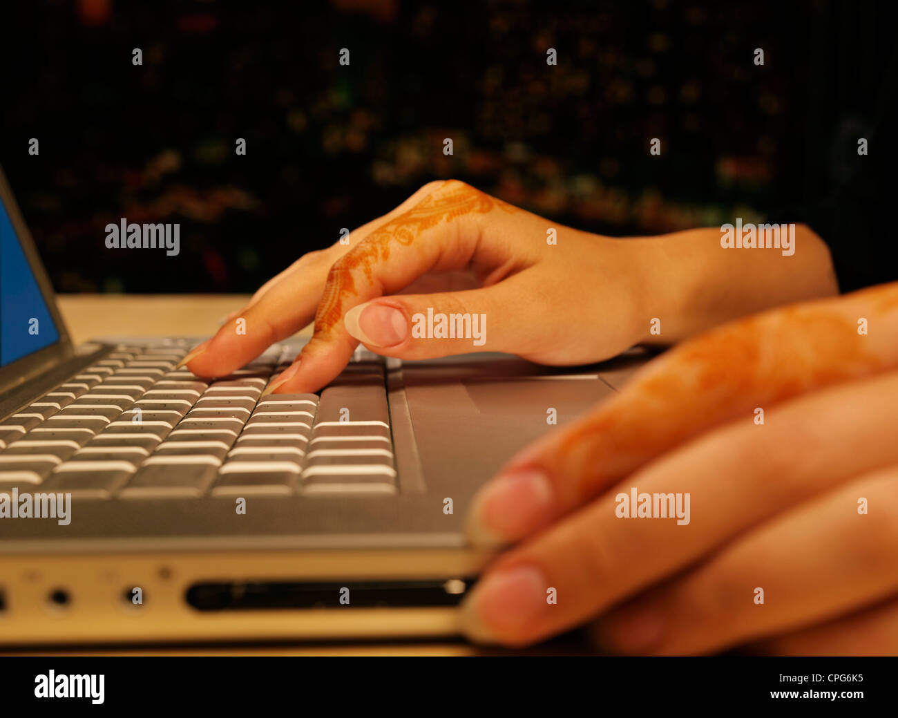 Hands with henna on keypad Stock Photo - Alamy