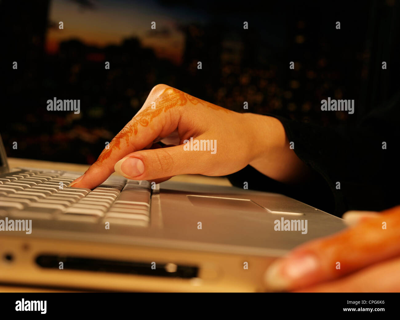 Hands with henna on keypad Stock Photo - Alamy