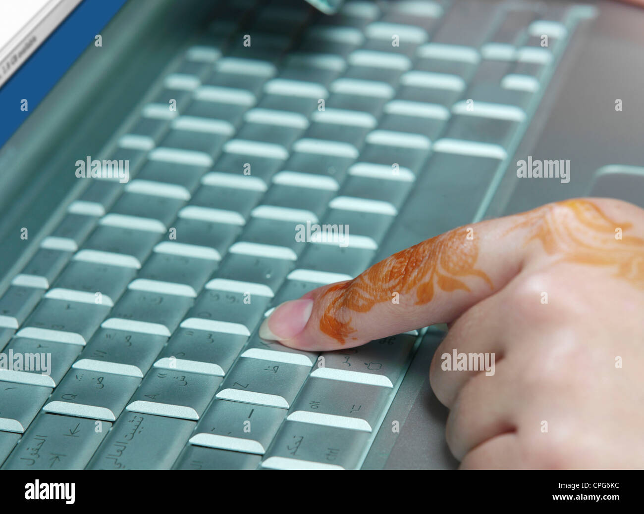 Hands with henna on keypad Stock Photo - Alamy