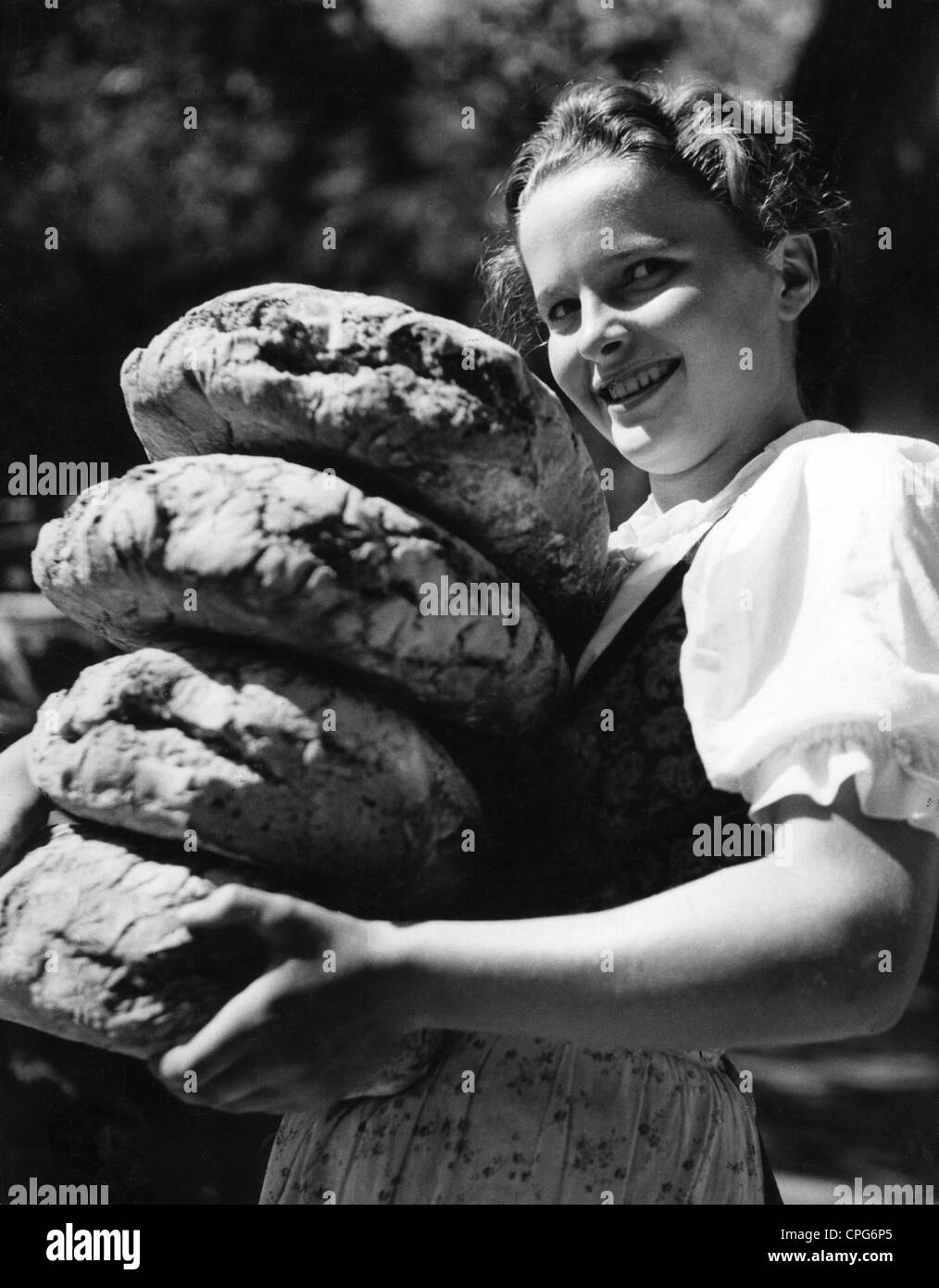 food, bread, girl with loafs of bread, circa 1950s, Additional-Rights ...