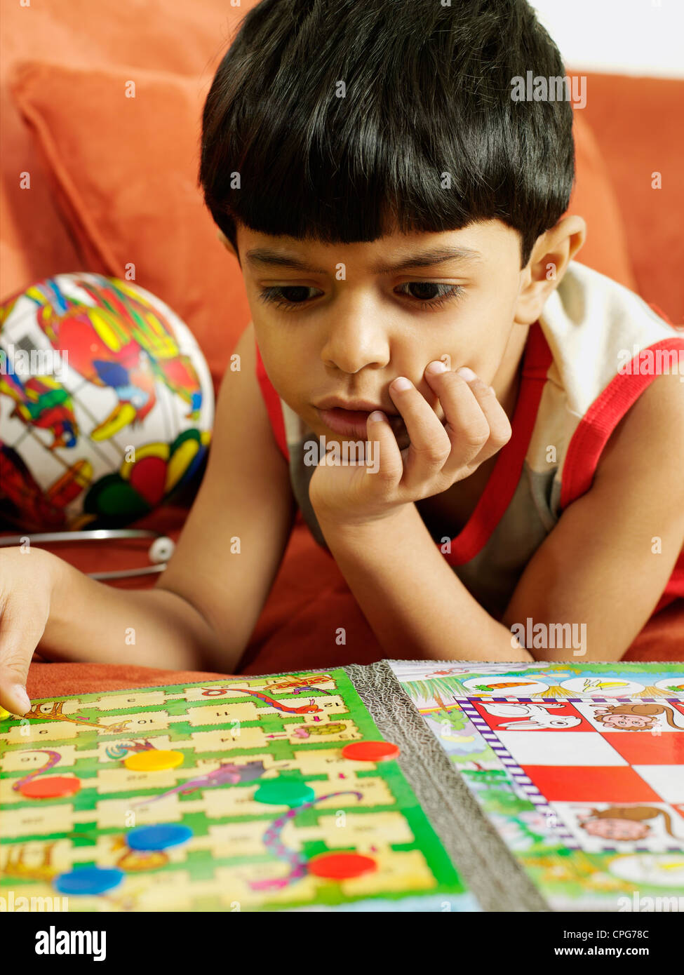 Boy playing Board game Stock Photo - Alamy