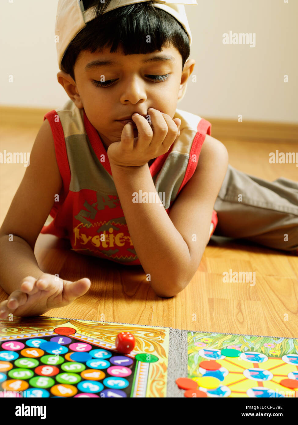 Boy Playing Board game Stock Photo - Alamy