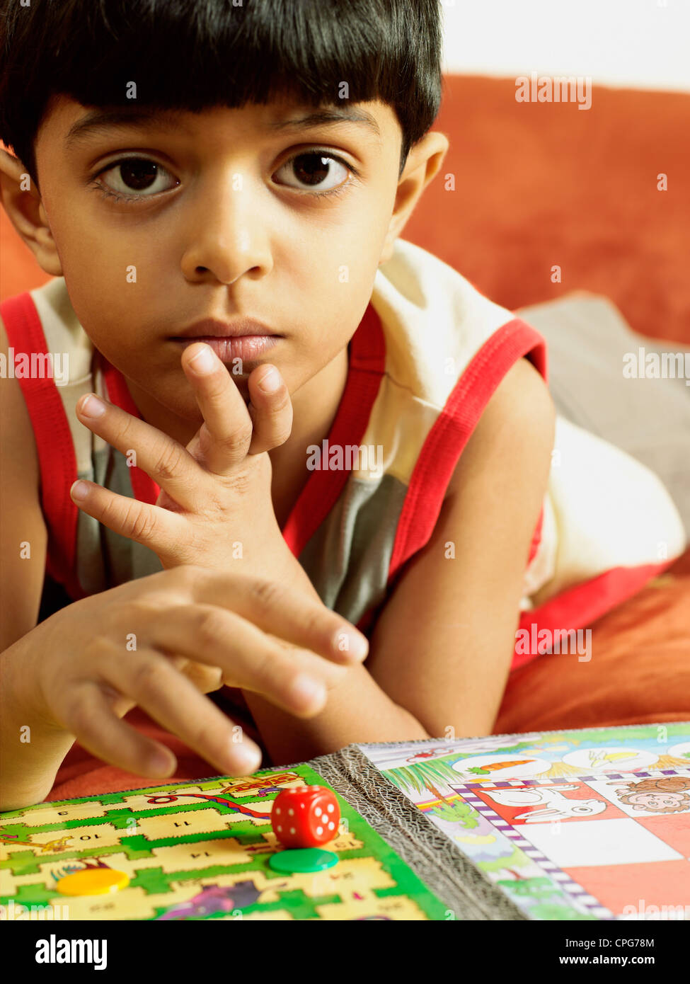 Boy playing Board game Stock Photo - Alamy
