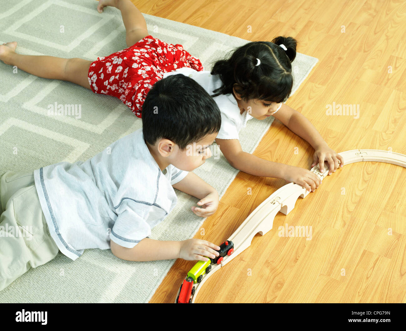 Children sharing toys hi-res stock photography and images - Alamy