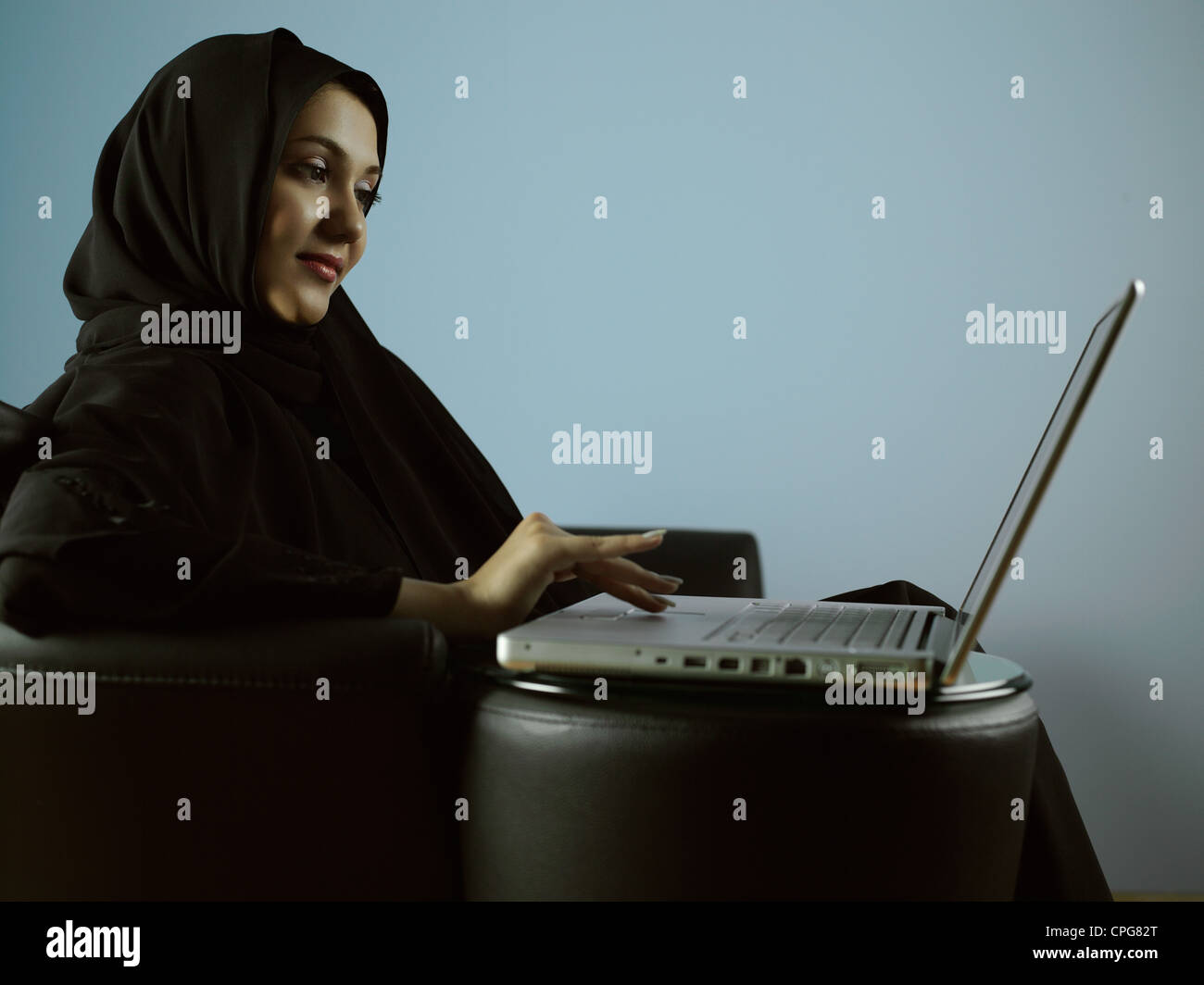 An Arab lady working on computer Stock Photo - Alamy