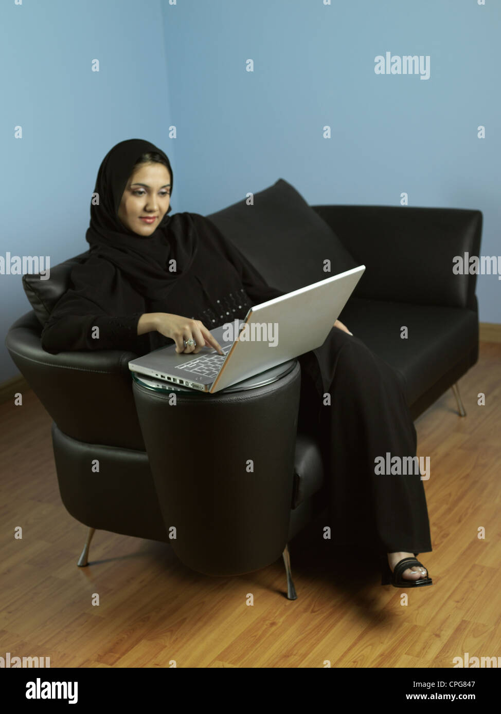 Arab lady working on laptop Stock Photo - Alamy