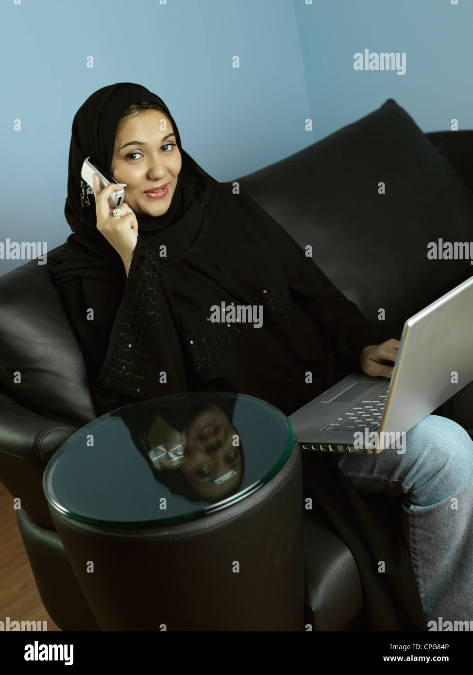 An Arab lady on the phone Stock Photo - Alamy