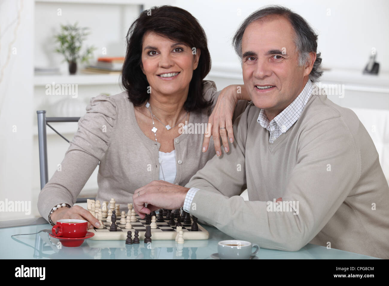 Couple playing chess together Stock Photo - Alamy