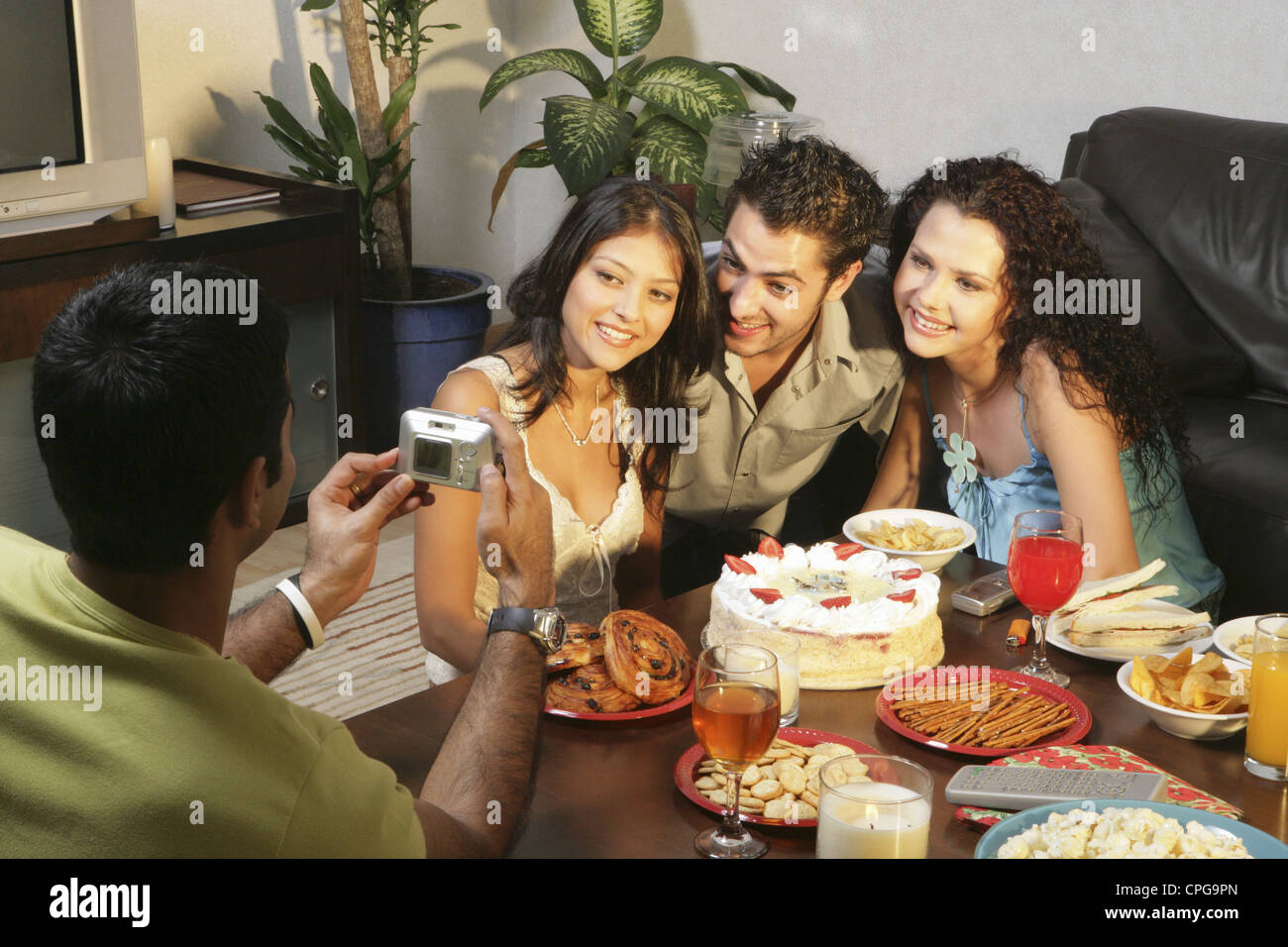 Young people socializing at home Stock Photo - Alamy