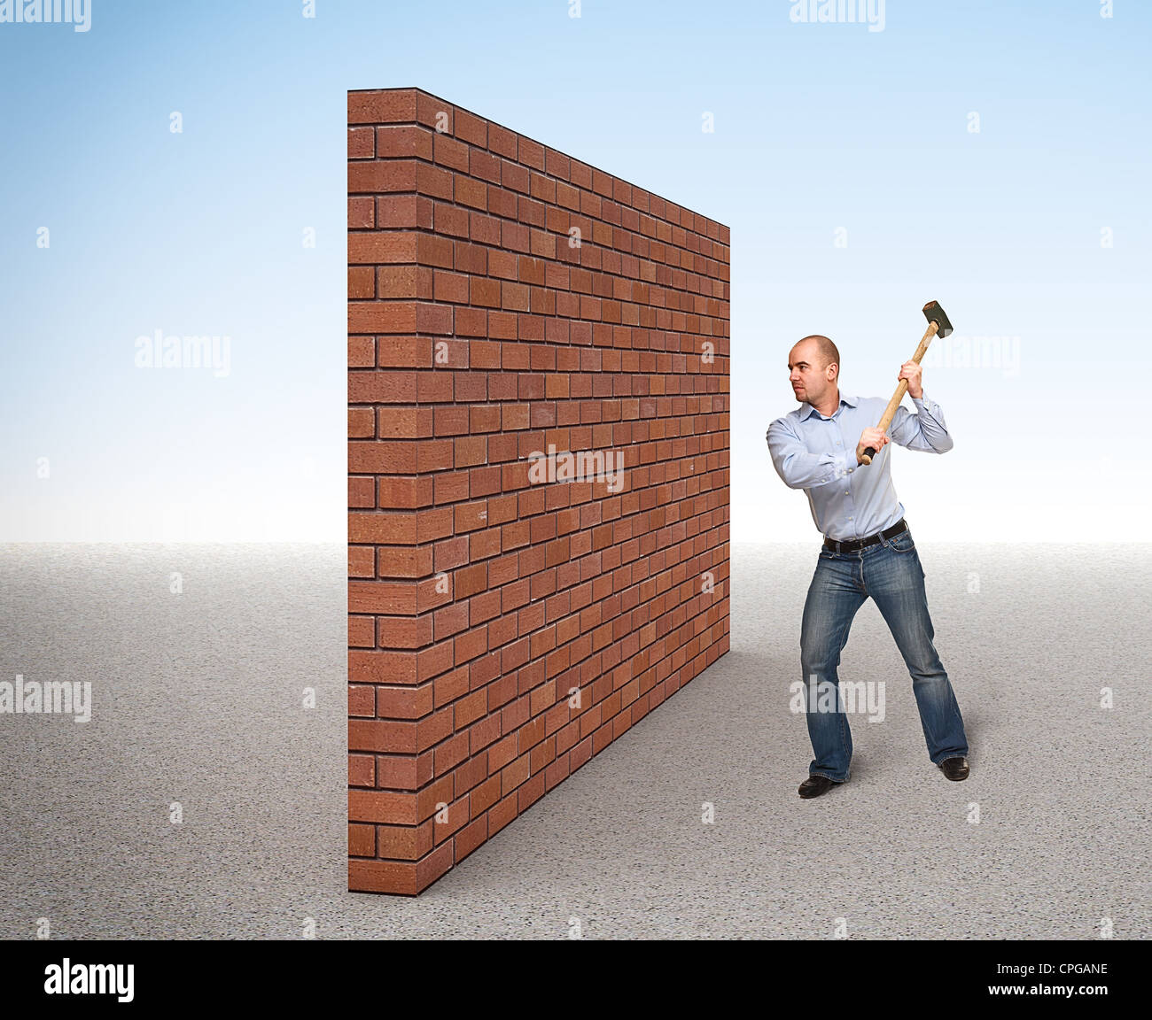 man with huge hammer and brick wall Stock Photo - Alamy