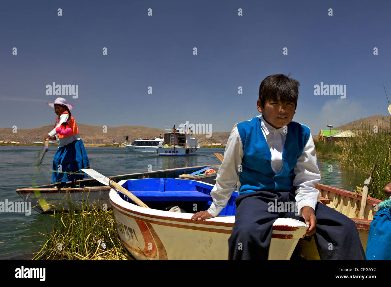 School children on boat, Islas Flotantes, floating islands, Lake ...