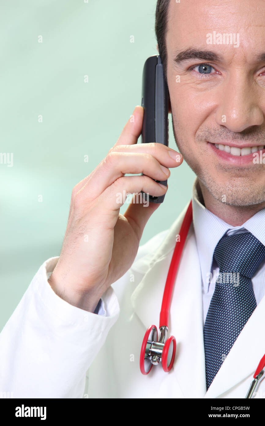 Doctor giving good news over the telephone Stock Photo - Alamy