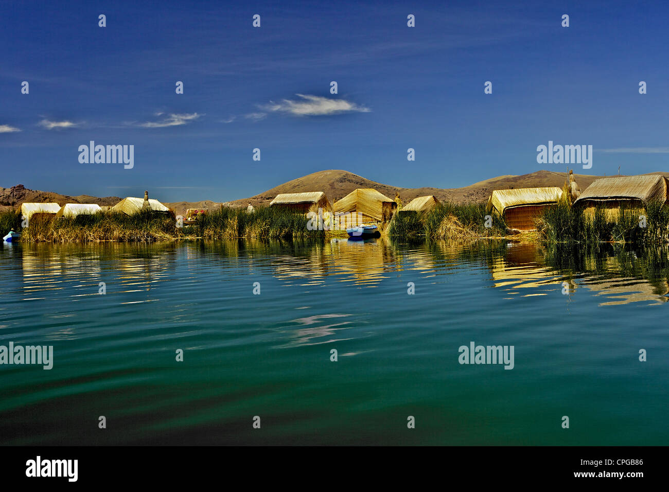 Floating islands of the Uros people, traditional reed boats and reed ...