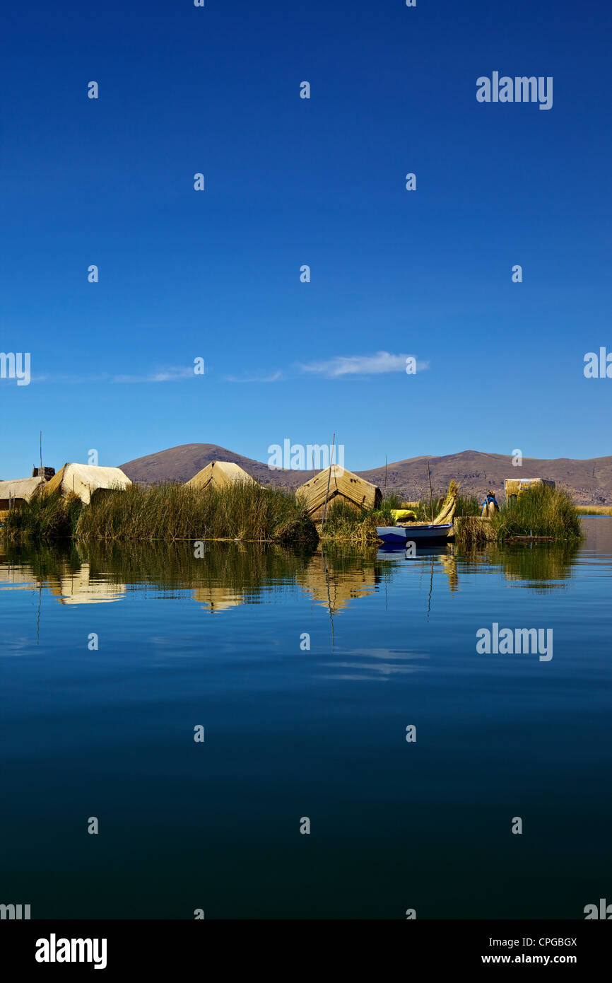 Floating islands of the Uros people, traditional reed houses and boat ...