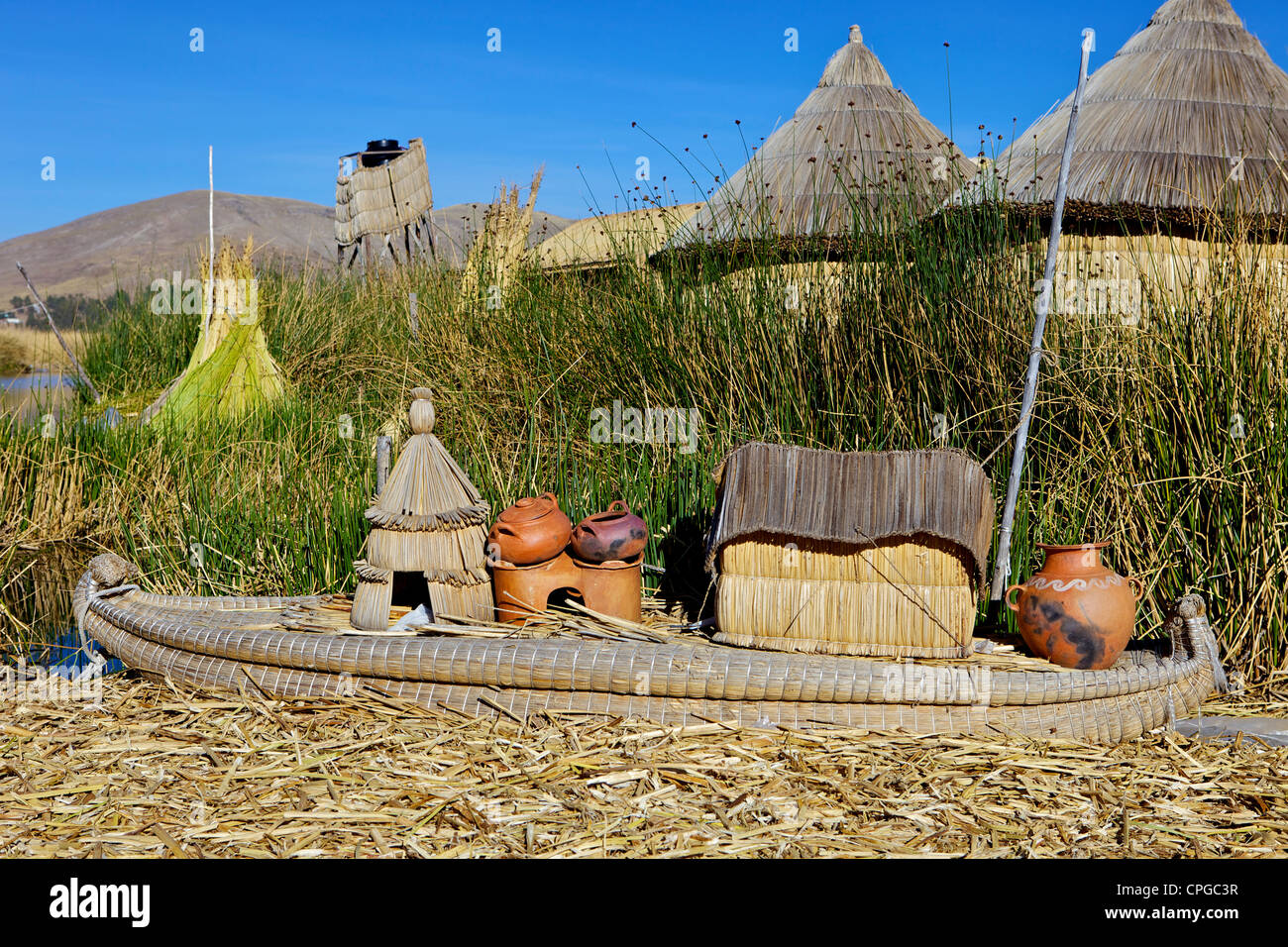 Traditional reed boat with minuture reed exhibits, Islas Flotantes ...