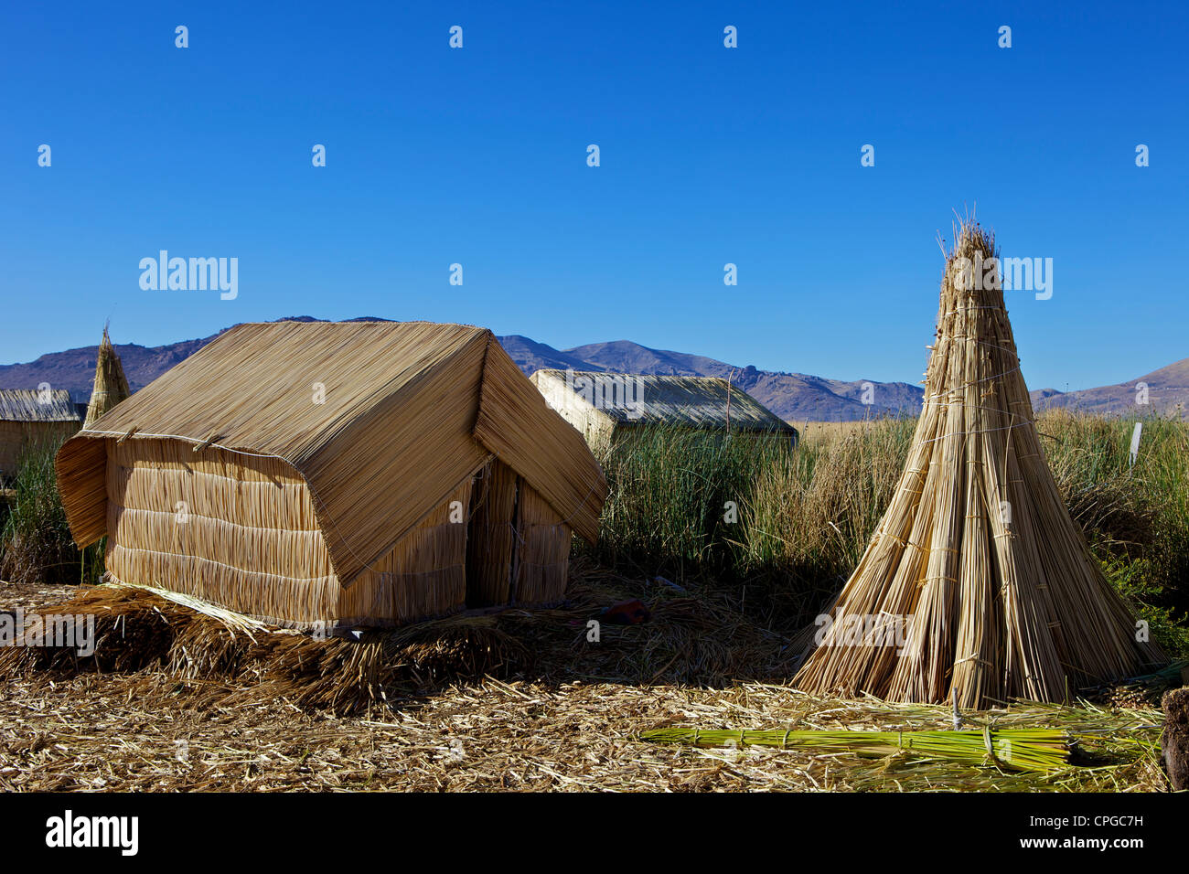Floating islands of the Uros people, traditional reed house, Lake ...