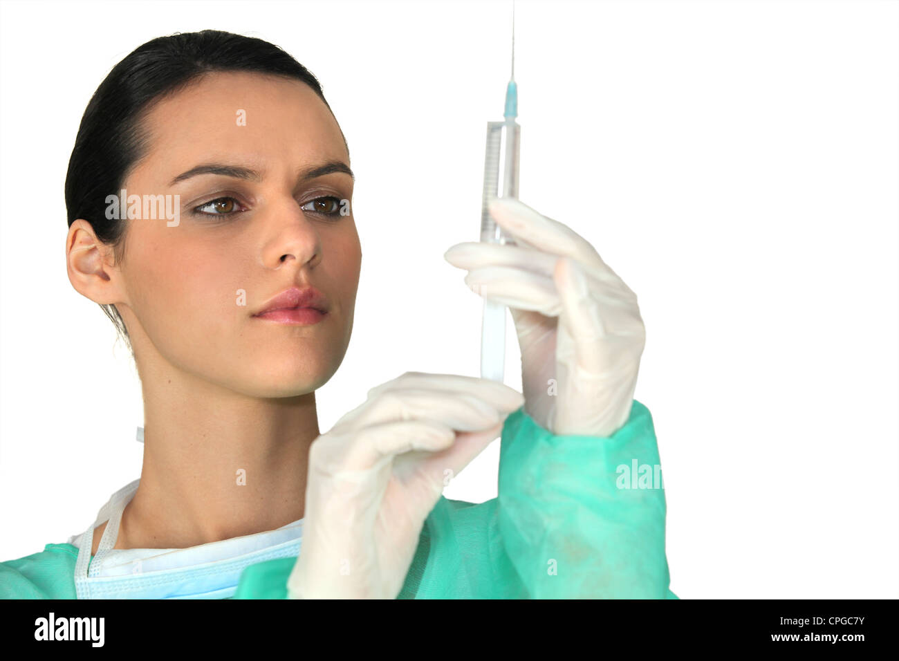 Female medic preparing a syringe Stock Photo - Alamy