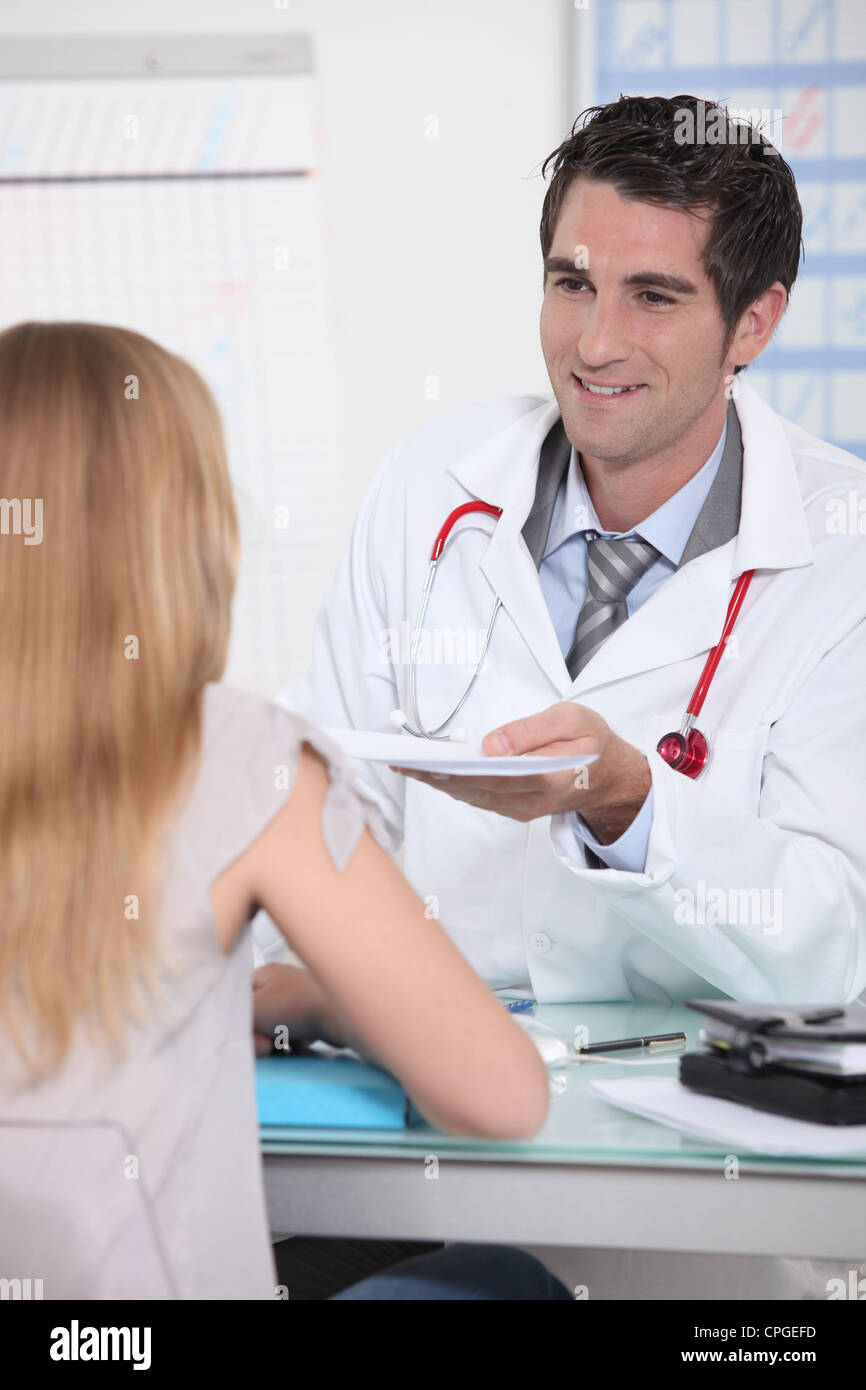 Handing a prescription hi-res stock photography and images - Alamy