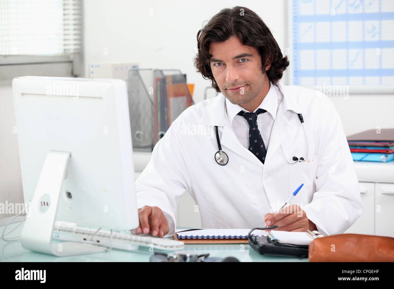 Doctor at a computer Stock Photo - Alamy