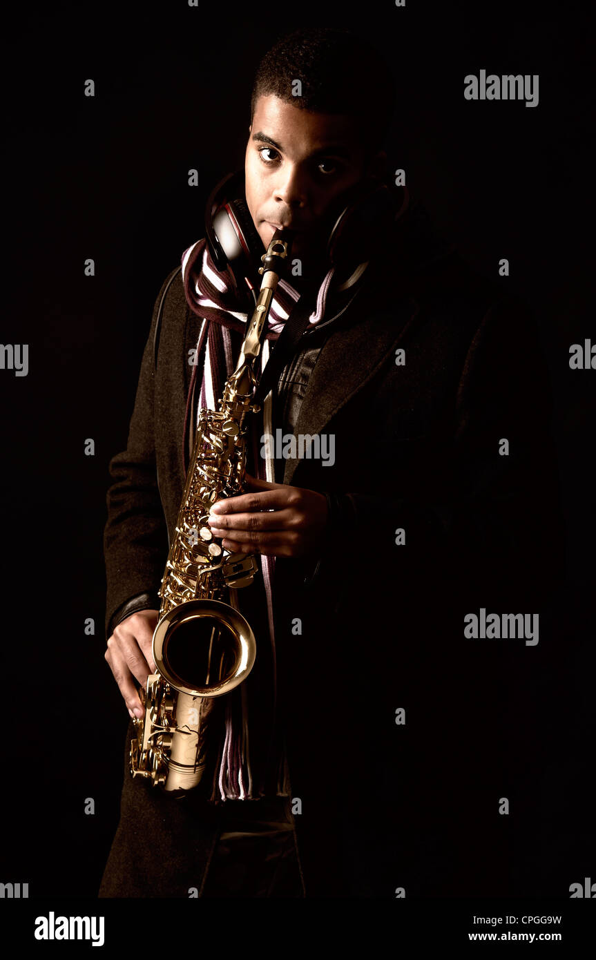 Stylish man playing the saxophone Stock Photo - Alamy