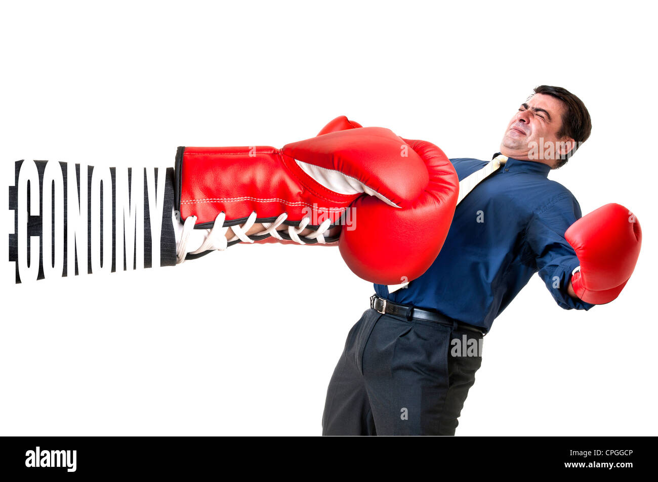 Businessman taking a hit by the economy's hand Stock Photo - Alamy