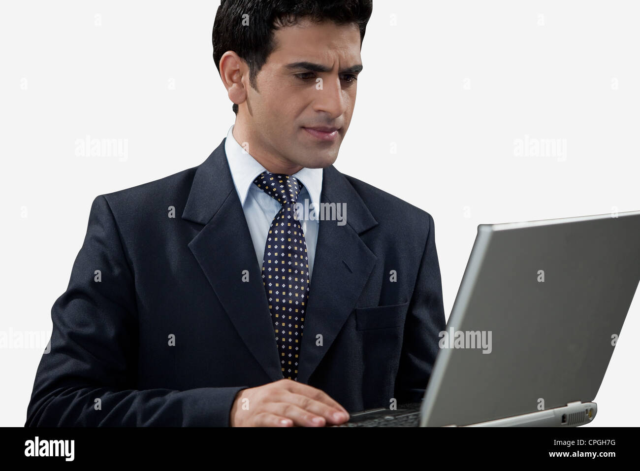 Man holding a laptop computer Stock Photo - Alamy