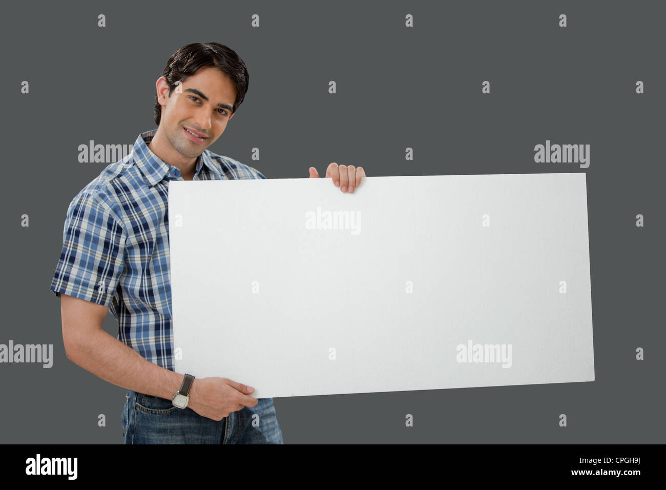 Portrait of man holding placard Stock Photo - Alamy