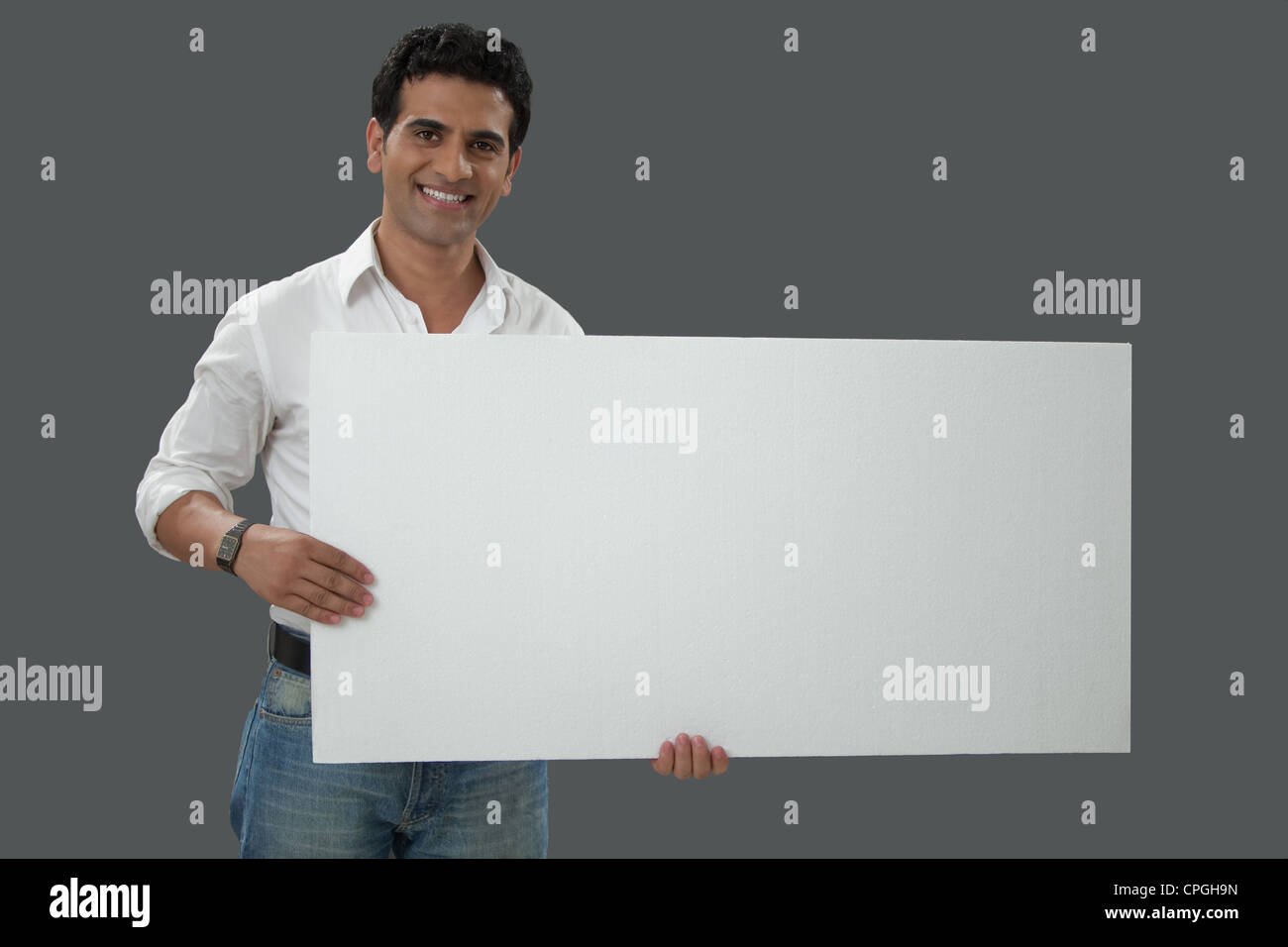 Portrait of man holding placard Stock Photo - Alamy