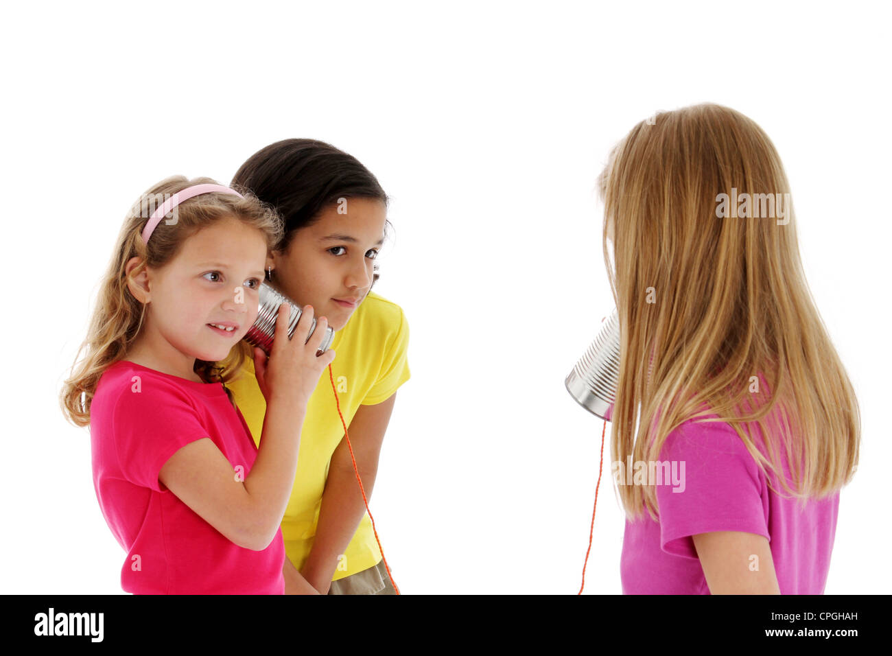 Kids playing with a toy telephone on white background Stock Photo - Alamy