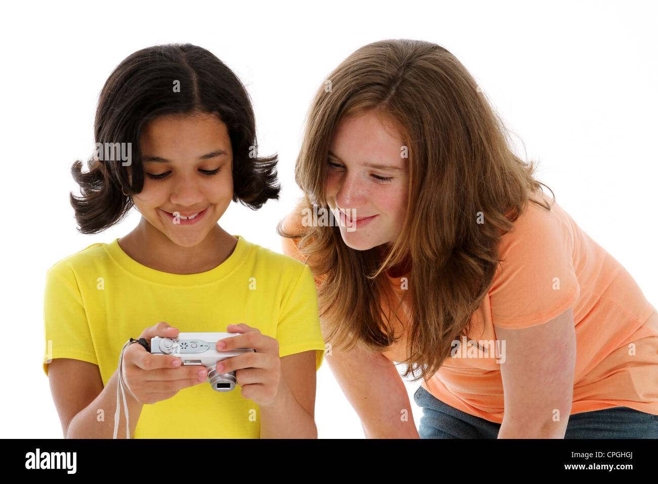 Girls looking at a camera on white background Stock Photo - Alamy